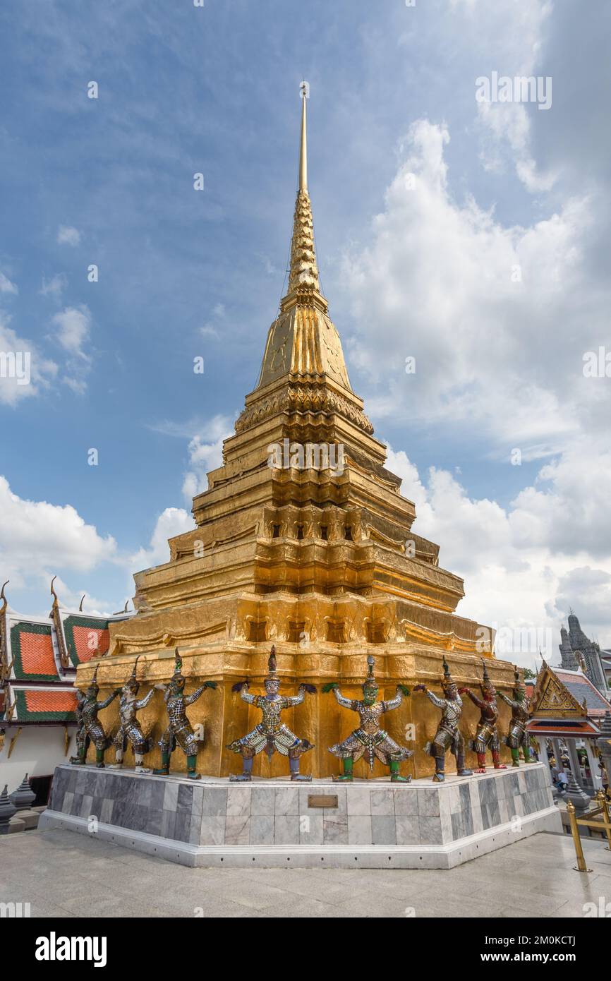 The demon guardian statues holding the golden pagoda at the Temple of ...