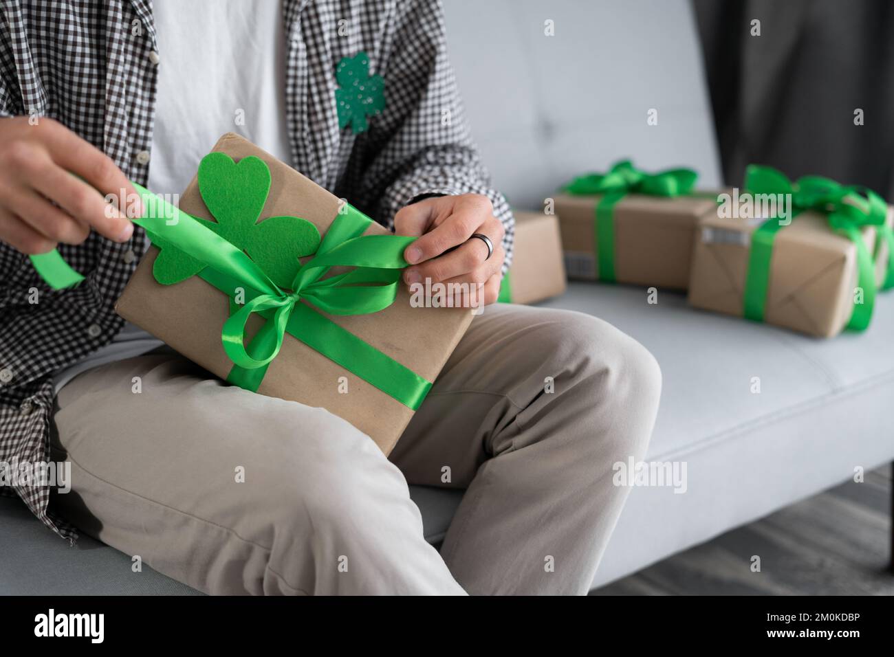 Gift wrapping for St. Patrick's Day, close-up. Copy space Stock Photo ...