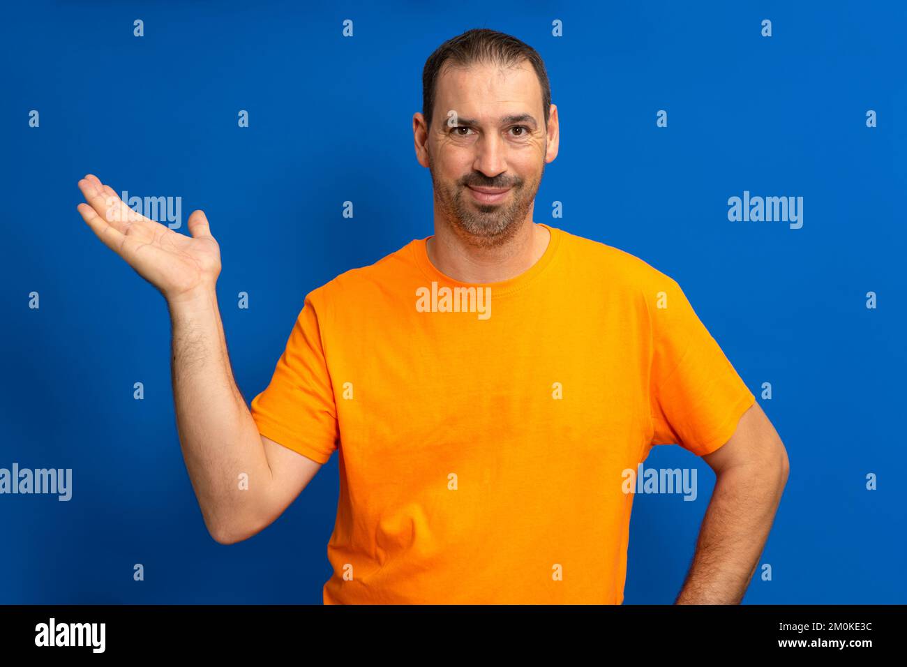 Handsome latino man offering hi-res stock photography and images - Alamy