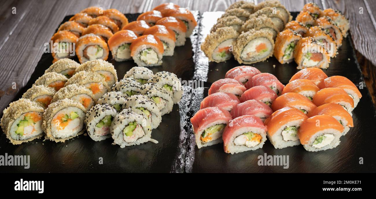 Rainbow Sushi Roll set with salmon, eel, tuna, avocado, royal prawn ...