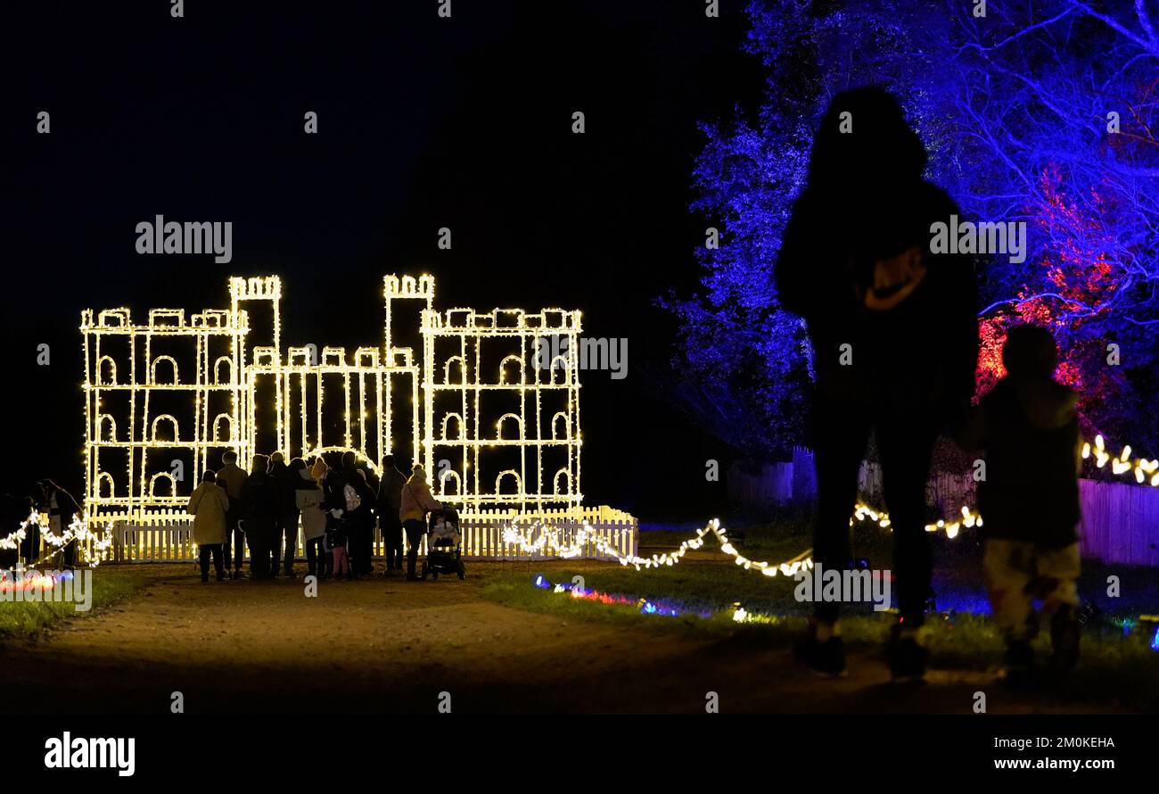 People make their way down to an illuminated model of Windsor Castle as ...