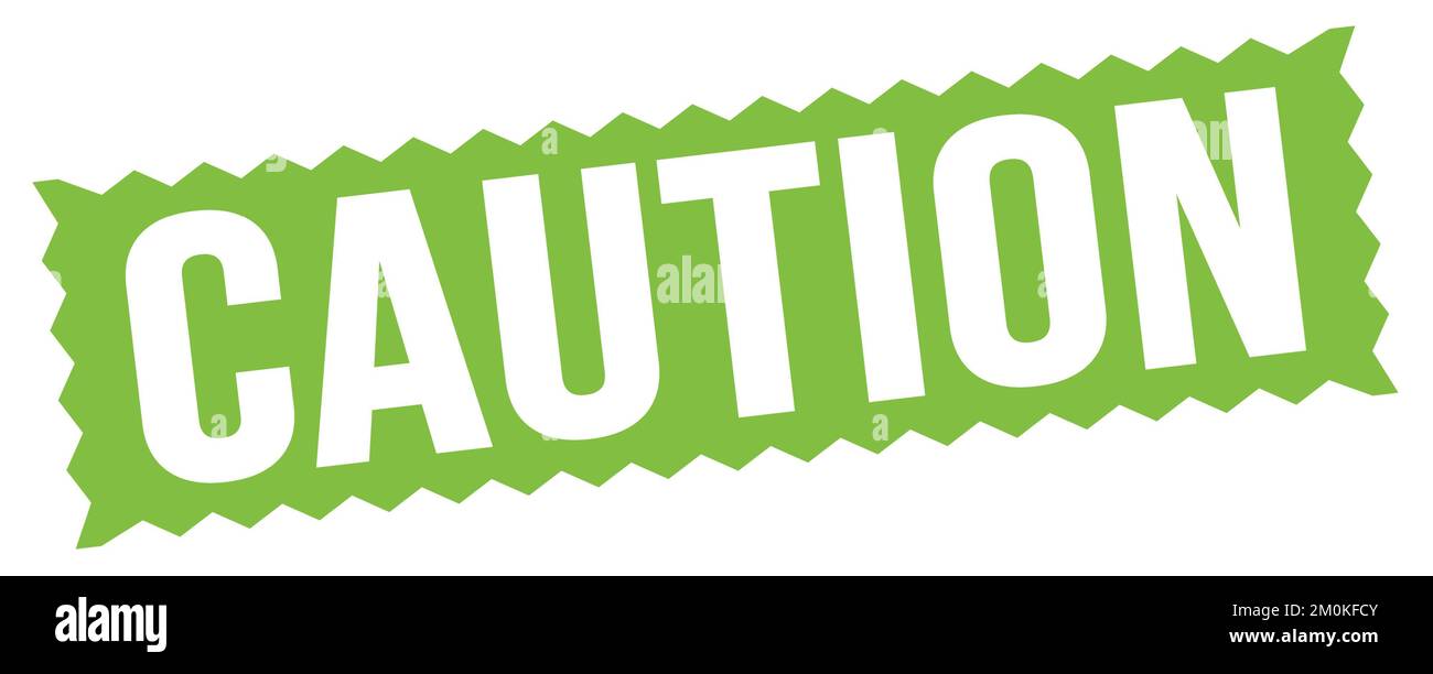 CAUTION text written on green zig-zag stamp sign Stock Photo - Alamy
