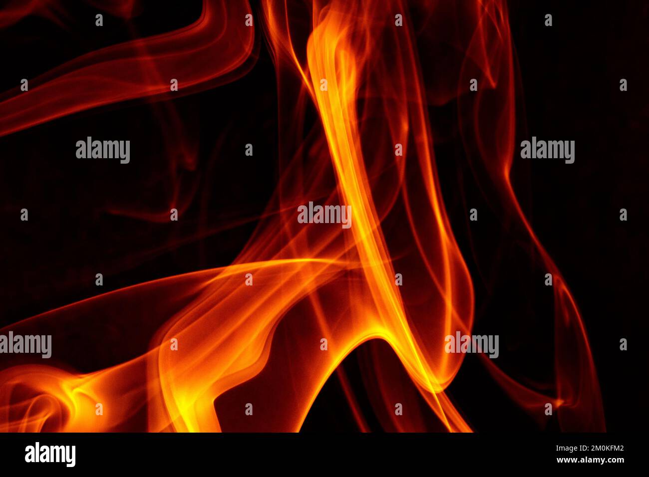 A dramatic wallpaper of red smoke resembling fire flames on the black ...