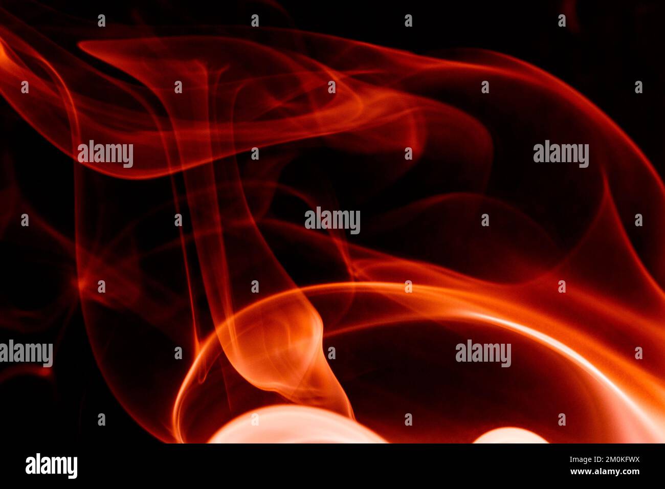 A dramatic wallpaper of red smoke resembling fire flames on the black ...