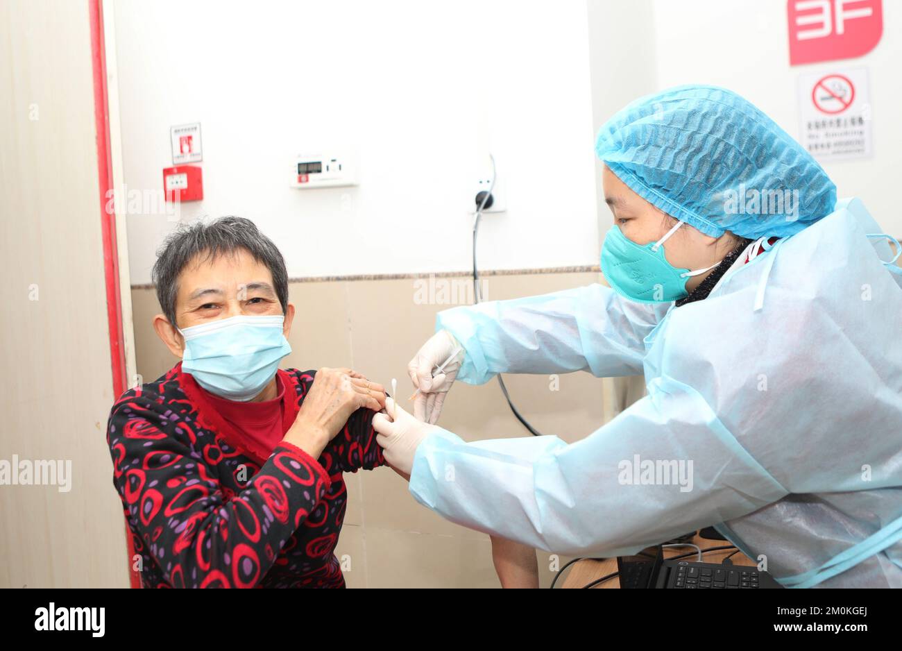CHONGQING, CHINA - DECEMBER 7, 2022 - Medical staff administer COVID-19 ...