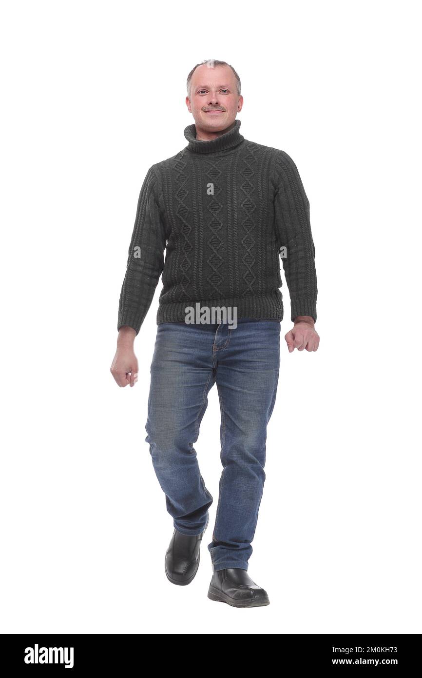 Full length picture of a casual senior man walking towards the camera ...