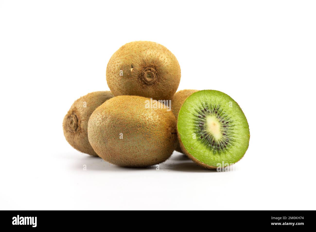 Green kiwi close-up; sliced kiwi; fresh fruit; vitamin supplement Stock ...