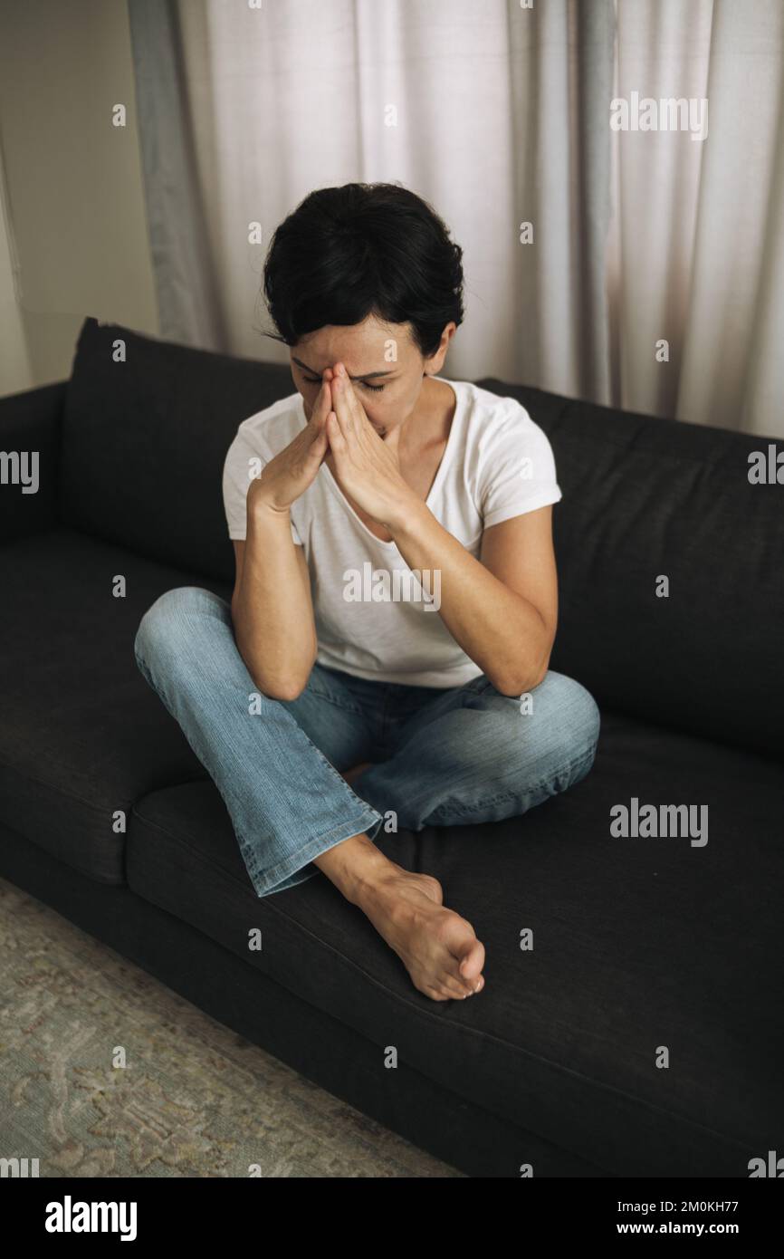 Woman is crying closing her face with her hands. Woman in depression ...
