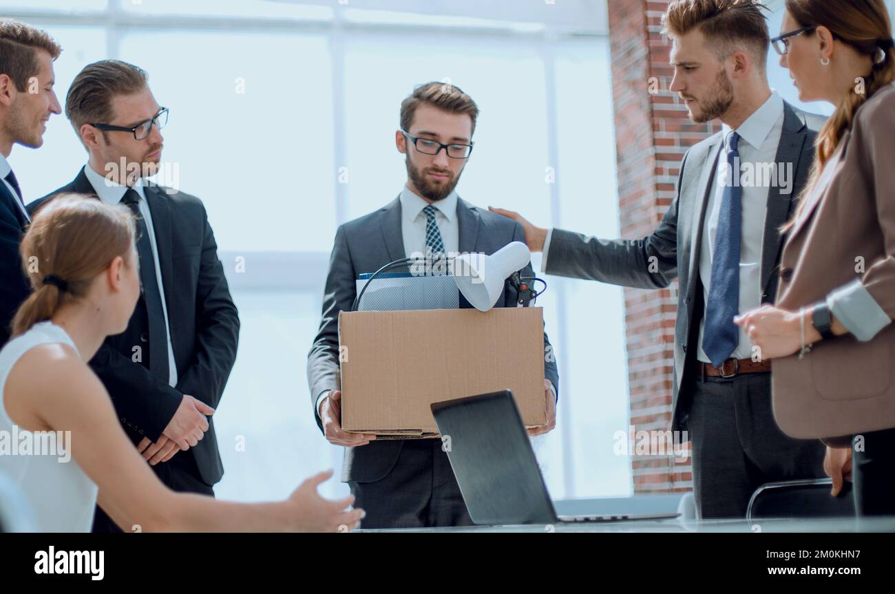 business colleagues say goodbye to the dismissed employee Stock Photo ...