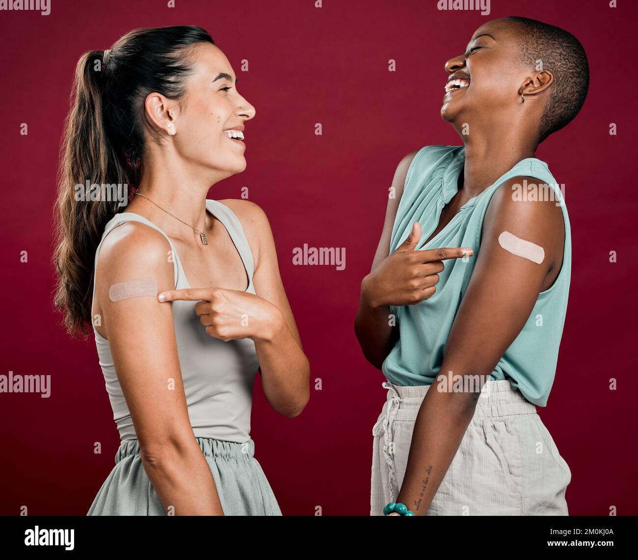 Covid vaccinated African american and mixed race women showing ...