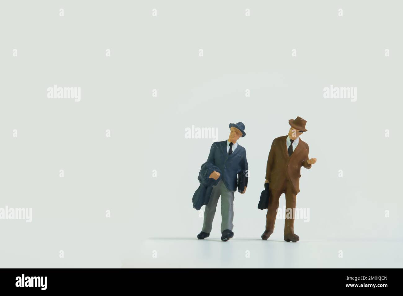 A miniature figure of businessmen in suits Stock Photo - Alamy