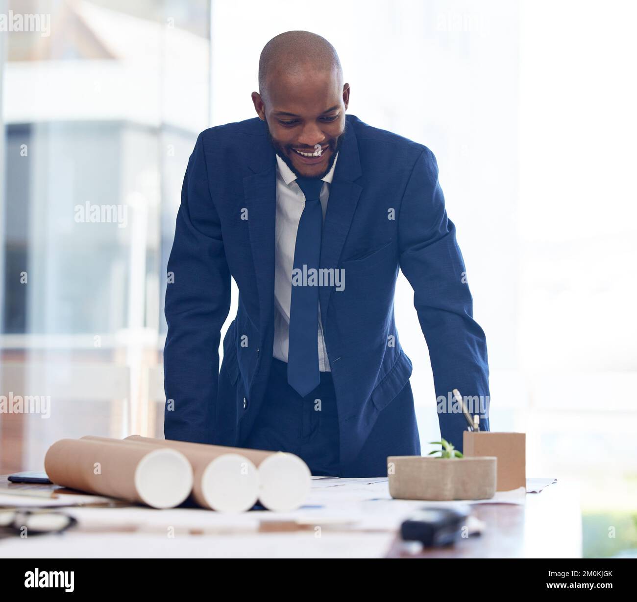 Businessman, happy and architect blueprint in office for building ...