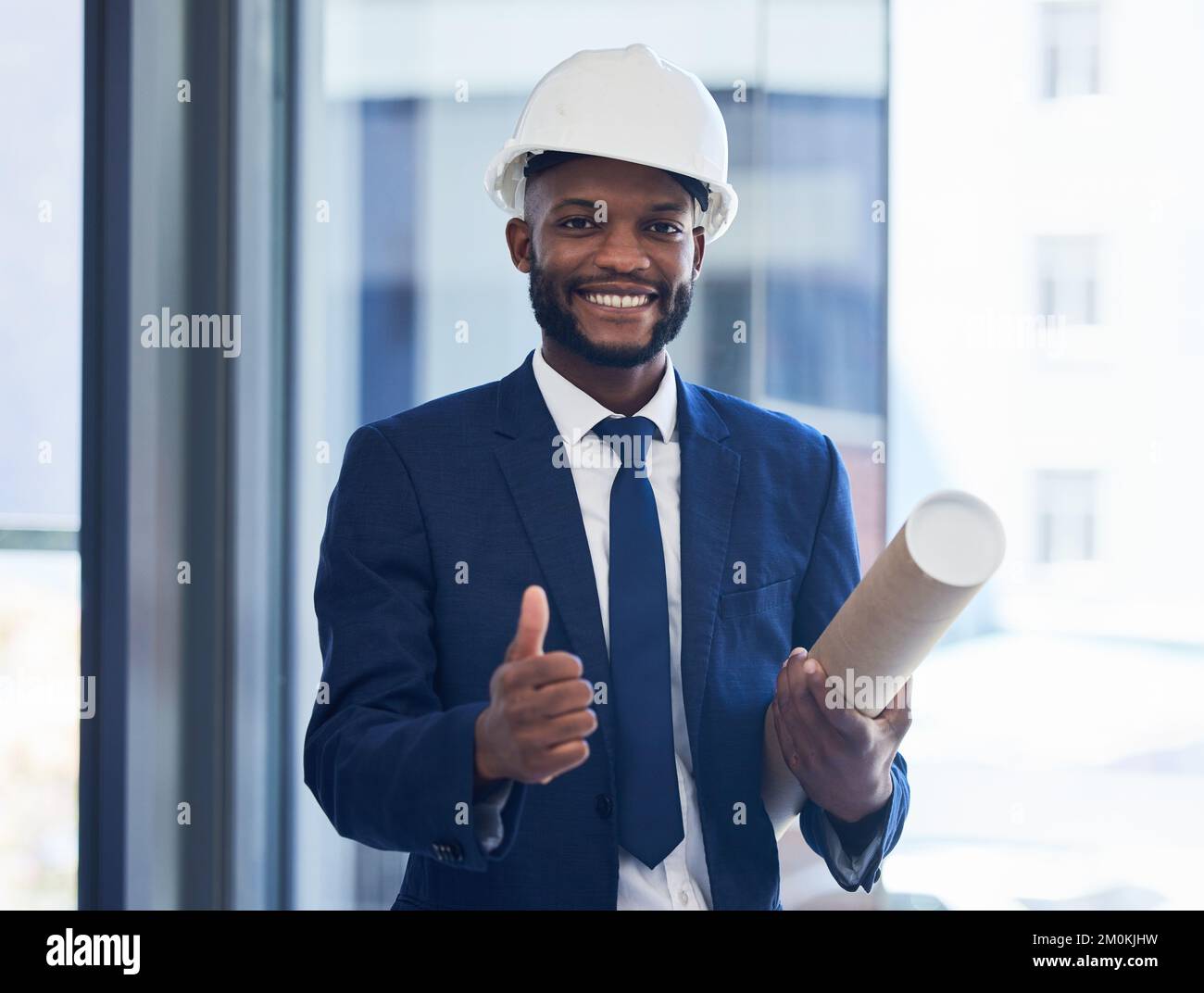 Thumbs up, happy engineer or architect black man with construction ...