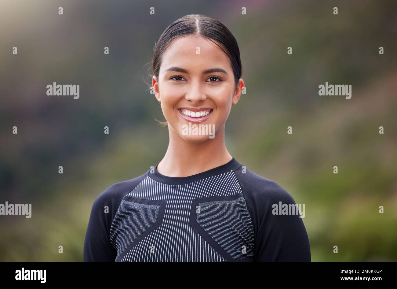 Beautiful, athletic, mixed race young woman exercising outside in a ...