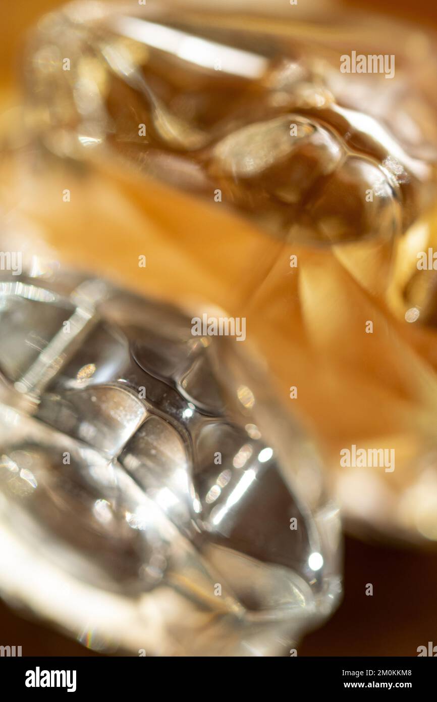 games of reflections of colors and lights through a glass bottle with ...