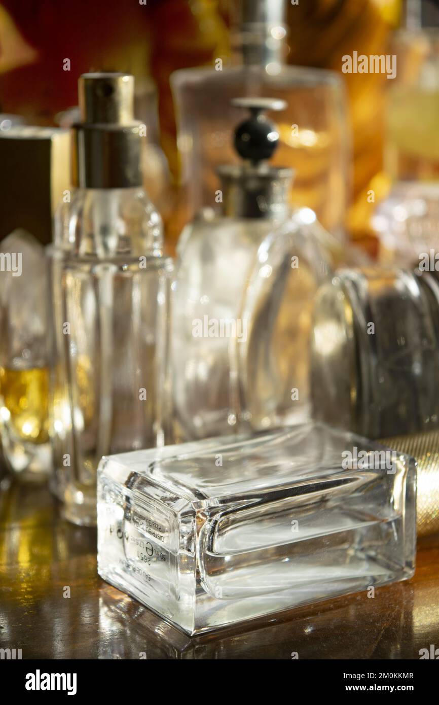 perfume bottles with reflections of lights and colors Stock Photo - Alamy