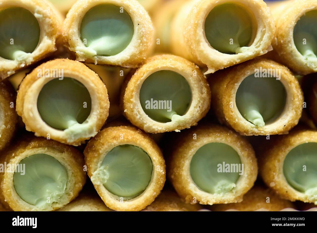 Crispy Italian Cannoli with sweet light green fillings Stock Photo - Alamy