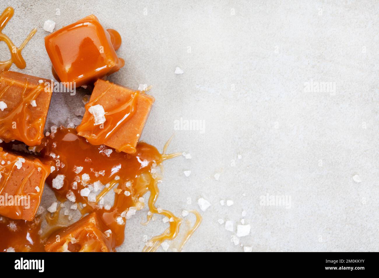 Salted caramel, a taste sensation. Coarse salt and caramel blocks ...