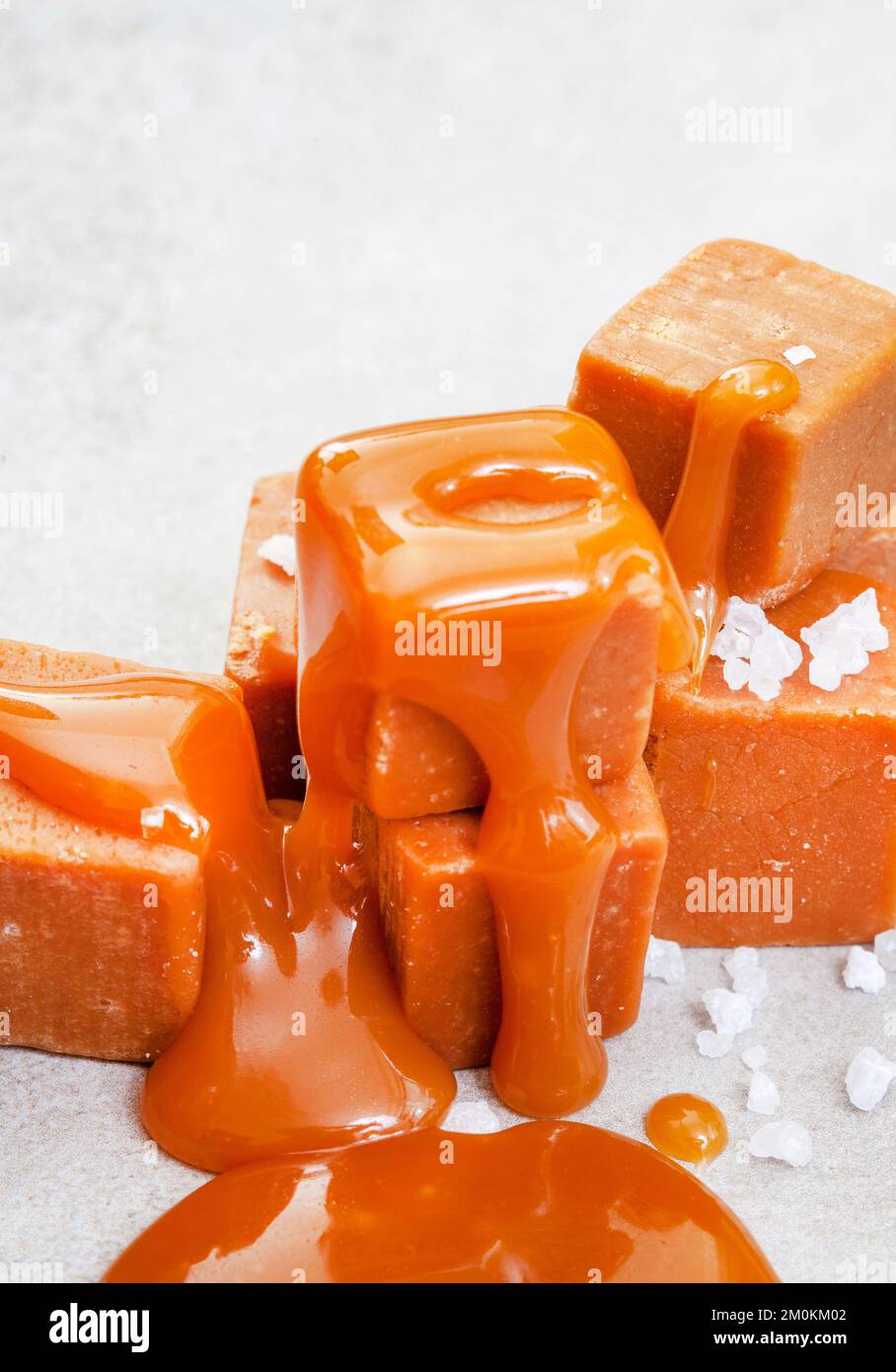 Salted caramel, a taste sensation. Coarse salt and caramel blocks ...