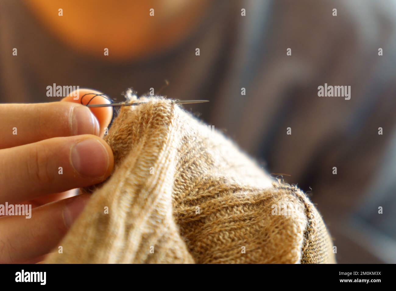 Mending clothes. Concept of mending and repairing clothes. Creative ...
