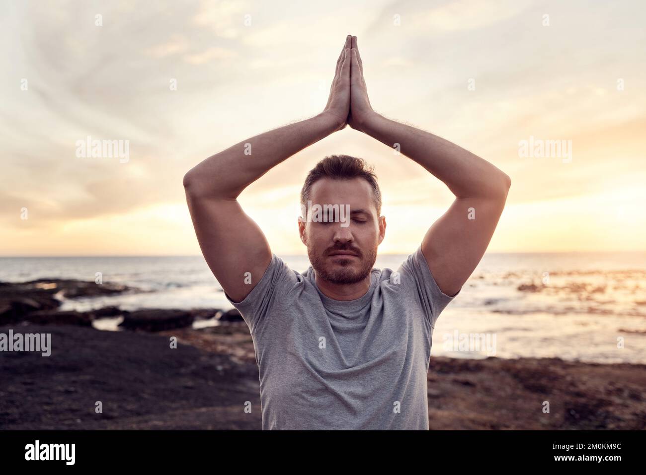 Zen man, beach meditation and sunset for peace, wellness or healthy ...