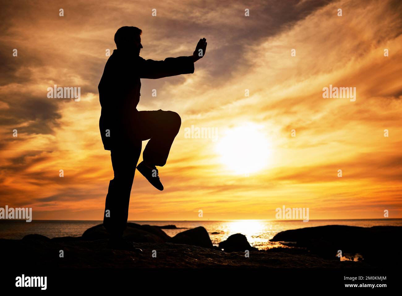 Karate, sunset and fitness with a sports man training outdoor on the ...