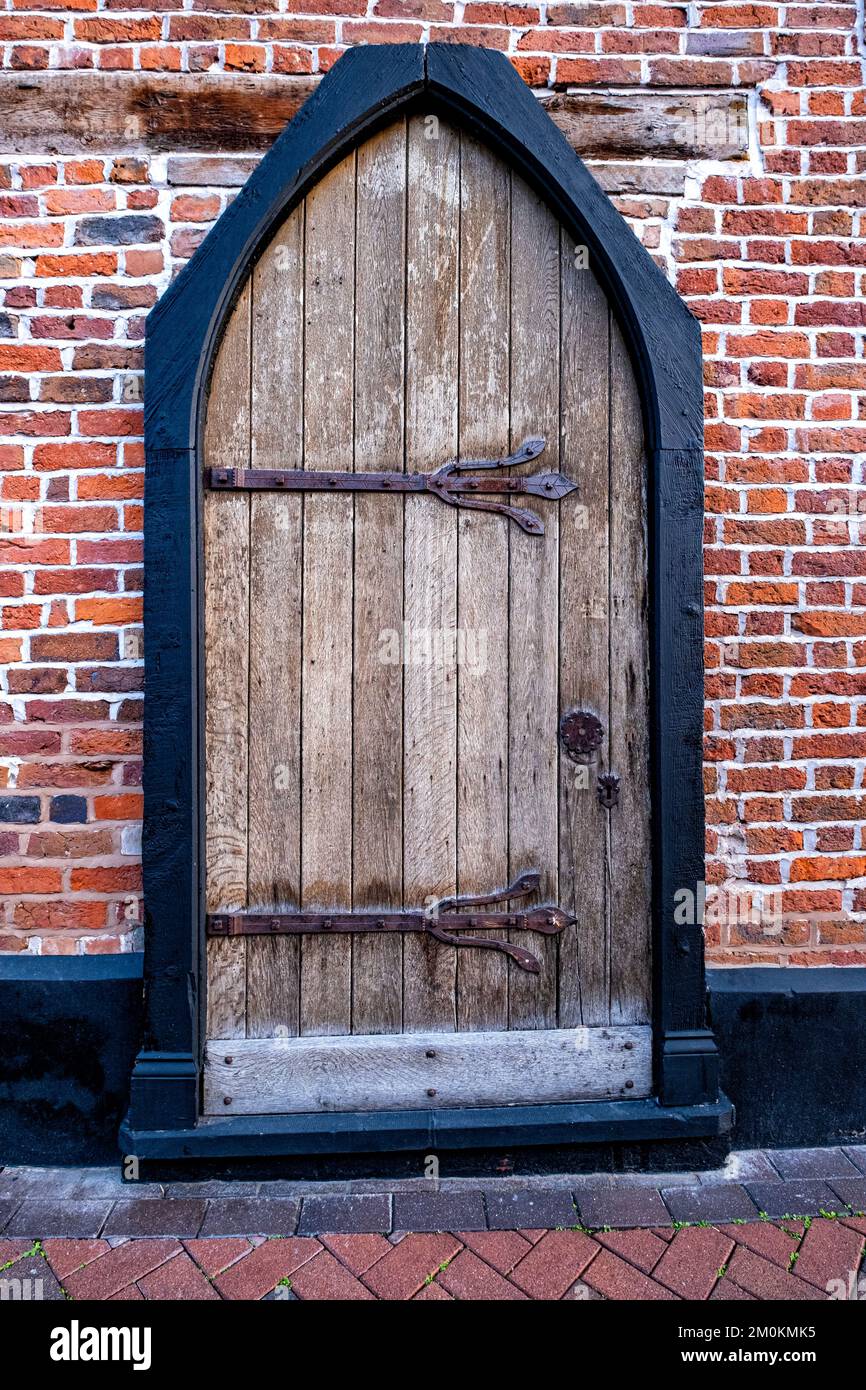Old wooden gothic door with ornate large hinges Stock Photo - Alamy