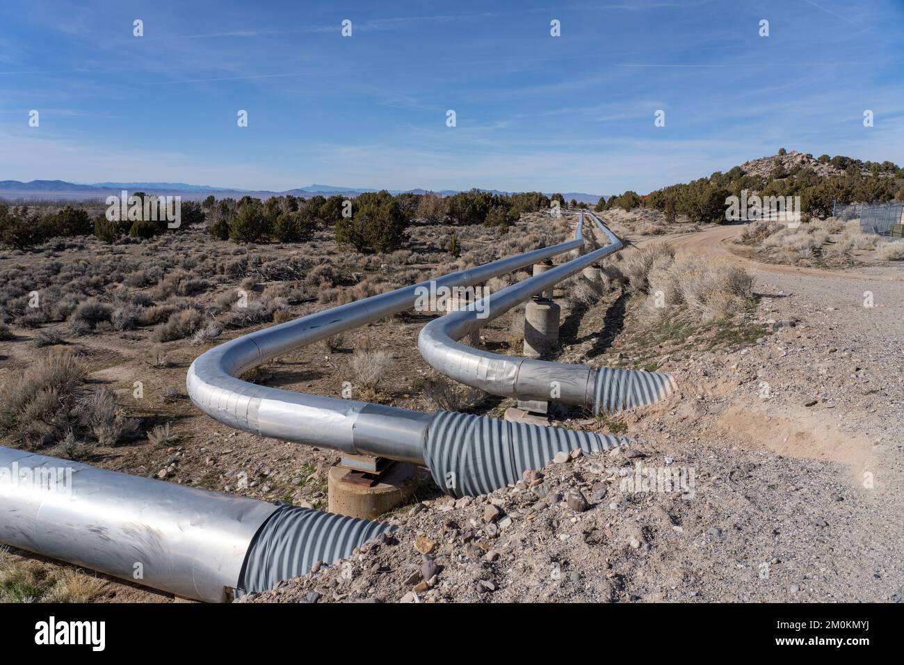 Steam and hot water pipelines feeding a geothermal plant Stock Photo ...