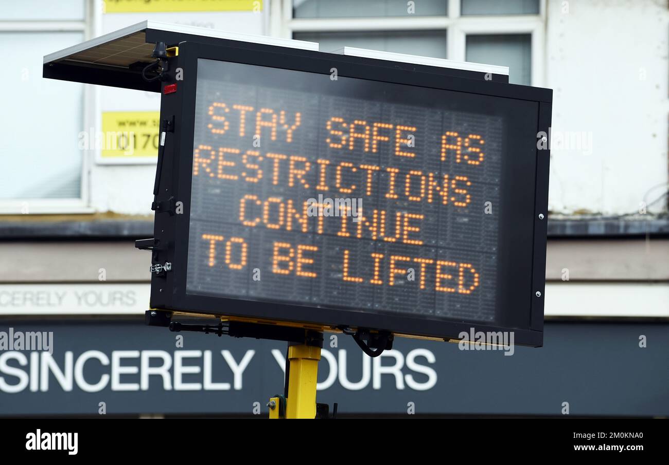 Covid-19 advice on matrix sign Stock Photo - Alamy