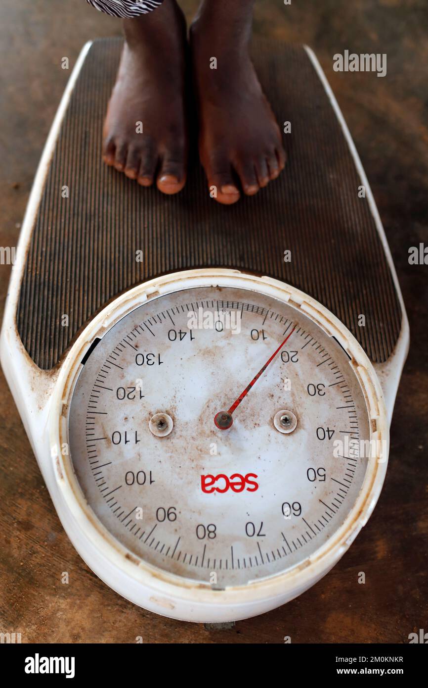 Boy being weighed Stock Photo - Alamy