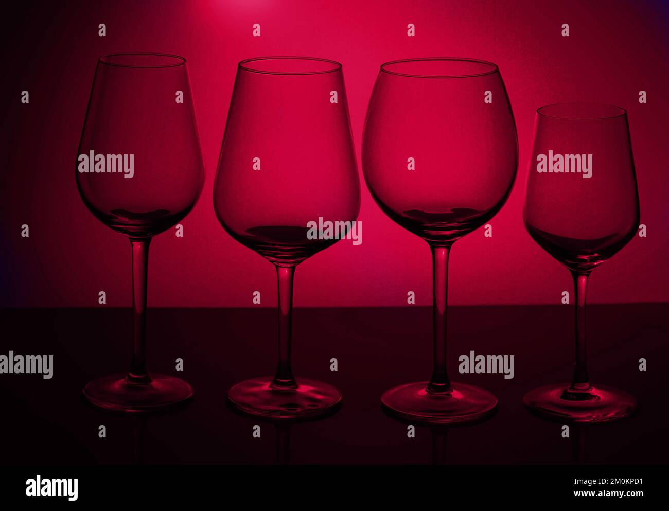 Wine glasses on blue Stock Photo - Alamy