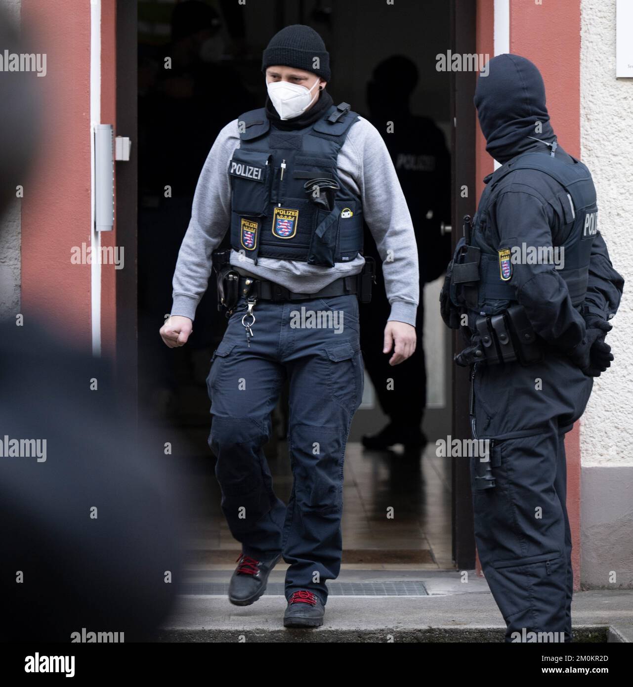 07 December 2022, Hessen, Frankfurt/Main: Police officers stand in ...