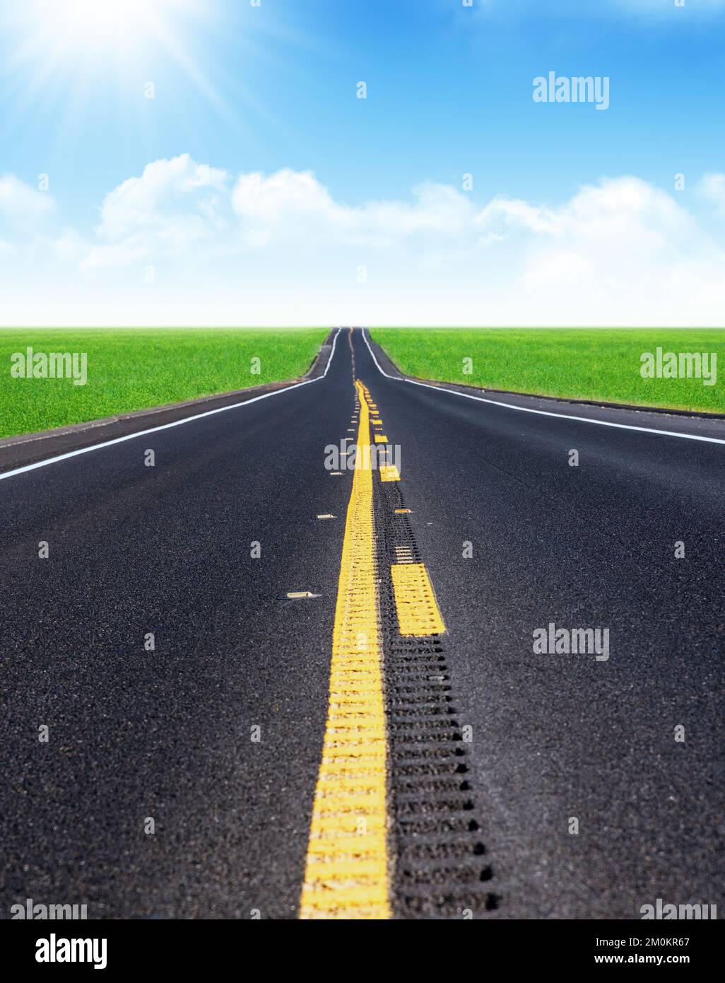 Asphalt road and country landscape with green meadows Stock Photo - Alamy