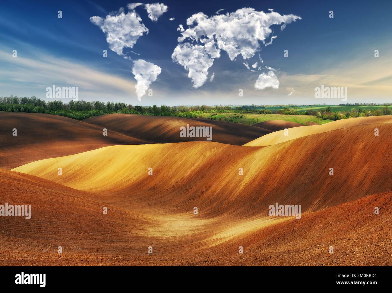 clouds in the form of a map of the world over the field. Travel and ...