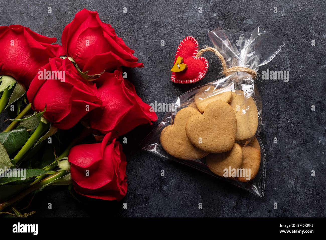 Valentines day card with heart shaped cookies, rose flowers and gift ...