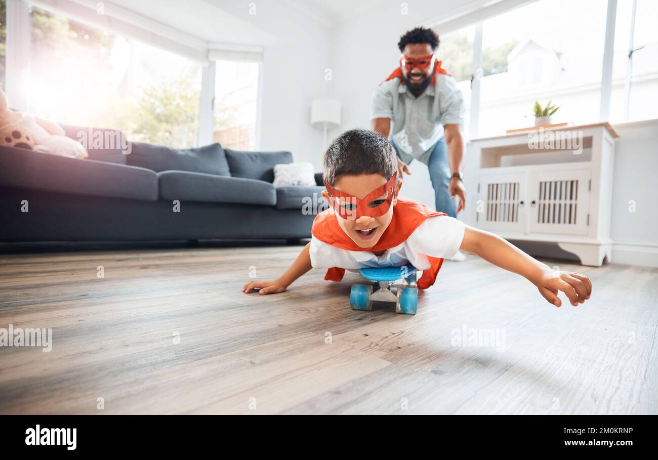 Hispanic father and son dressed up like superheroes and playing in the ...