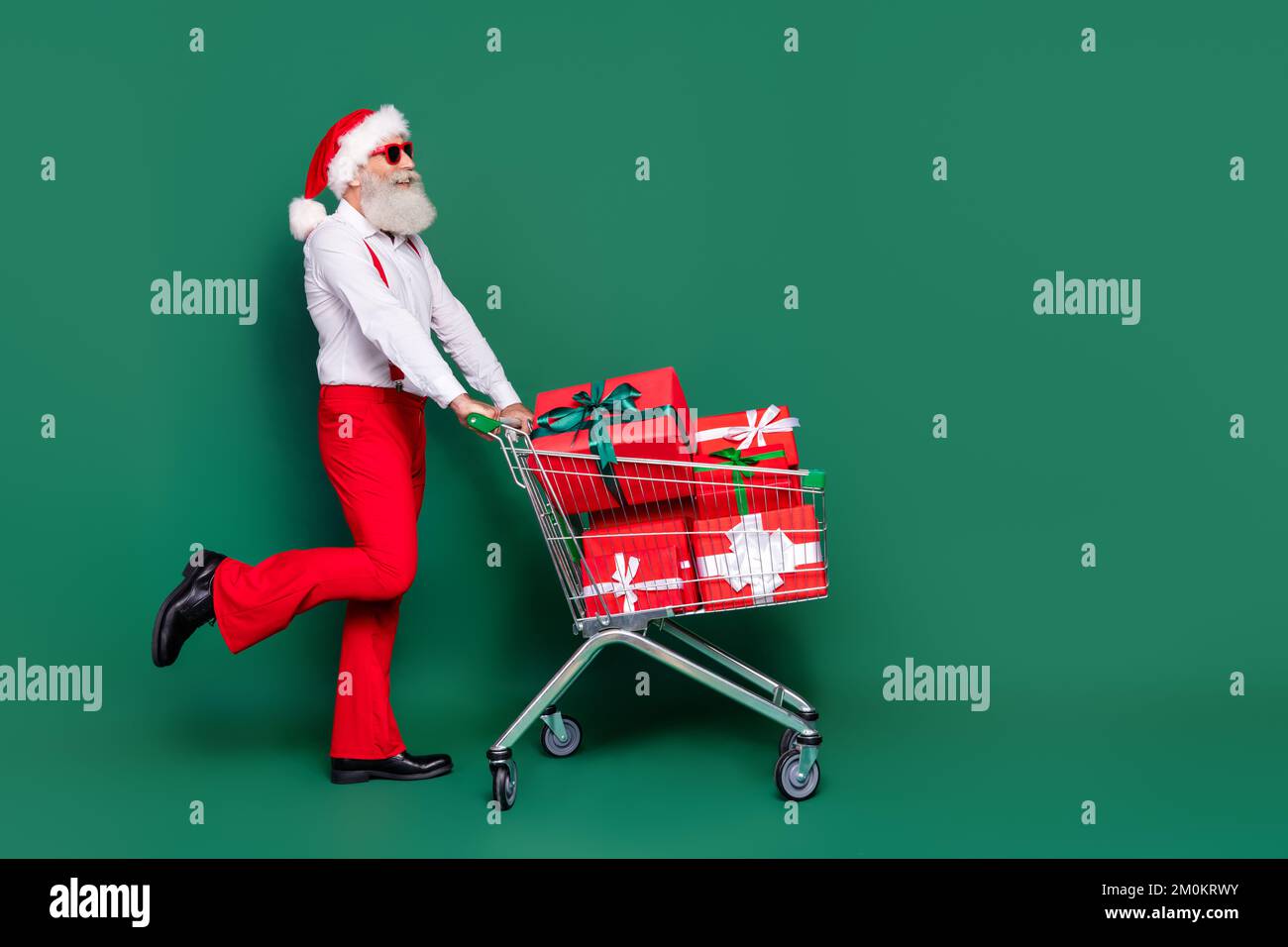 Full length photo of dreamy sweet guy wear x-mas costume walking tray ...
