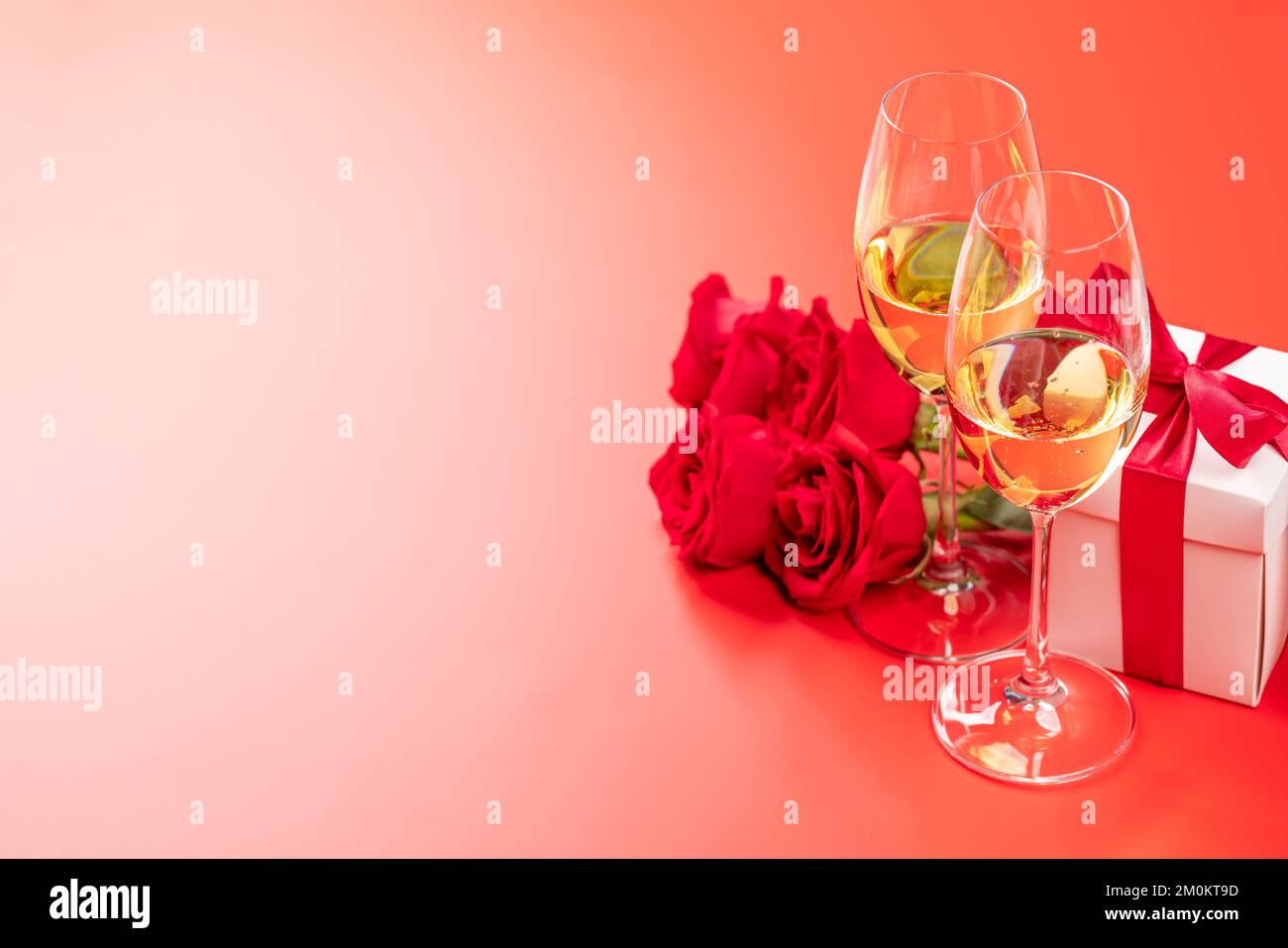Valentines day card with champagne, rose flowers and gift box. On red ...