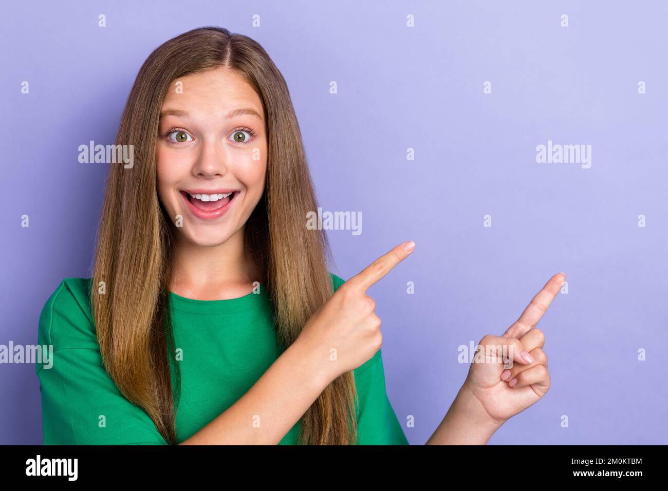 Photo of overjoyed astonished lady demonstrates empty space cool offer ...