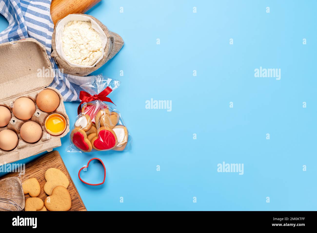 Cooking gingerbread heart cookies for Valentines day holiday. Flat lay ...