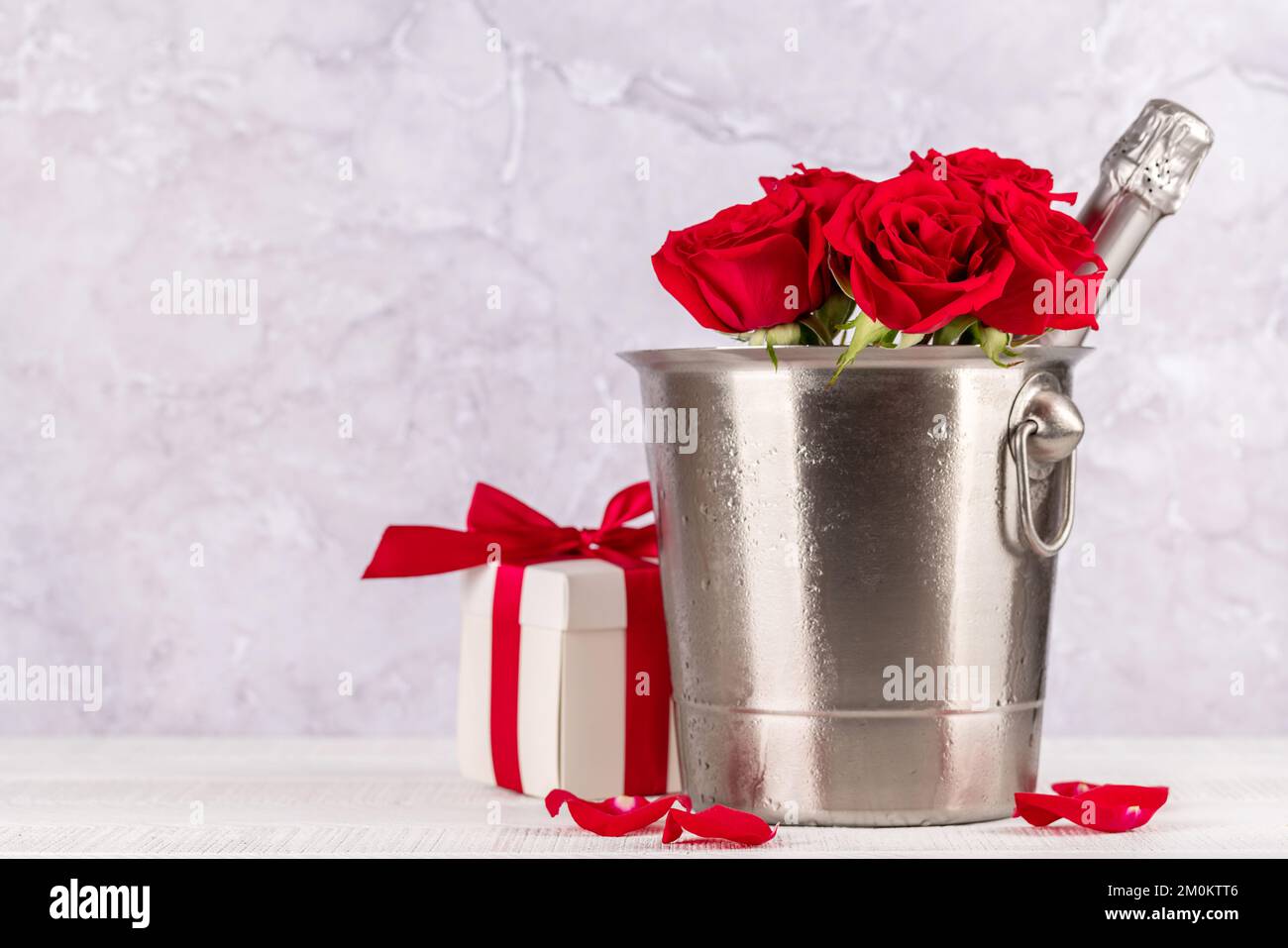 Valentines day card with champagne, rose flowers and gift box. With ...