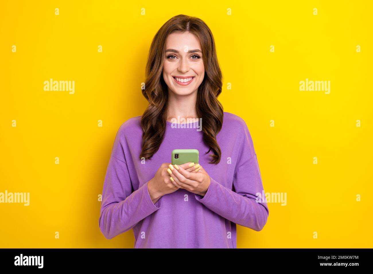 Photo of young satisfied pretty lady blogger hold her new apple iphone ...