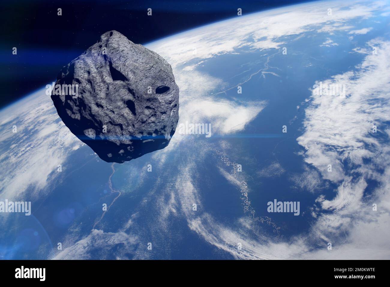 Planet Earth and big asteroid in the space. Asteroid in outer space near Earth planet. Meteorite ...