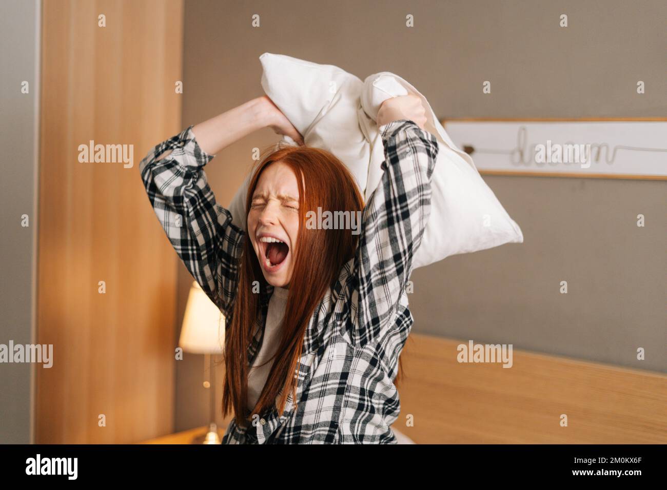 Close-up of angry irritated annoyed woman shouting and yelling with ...
