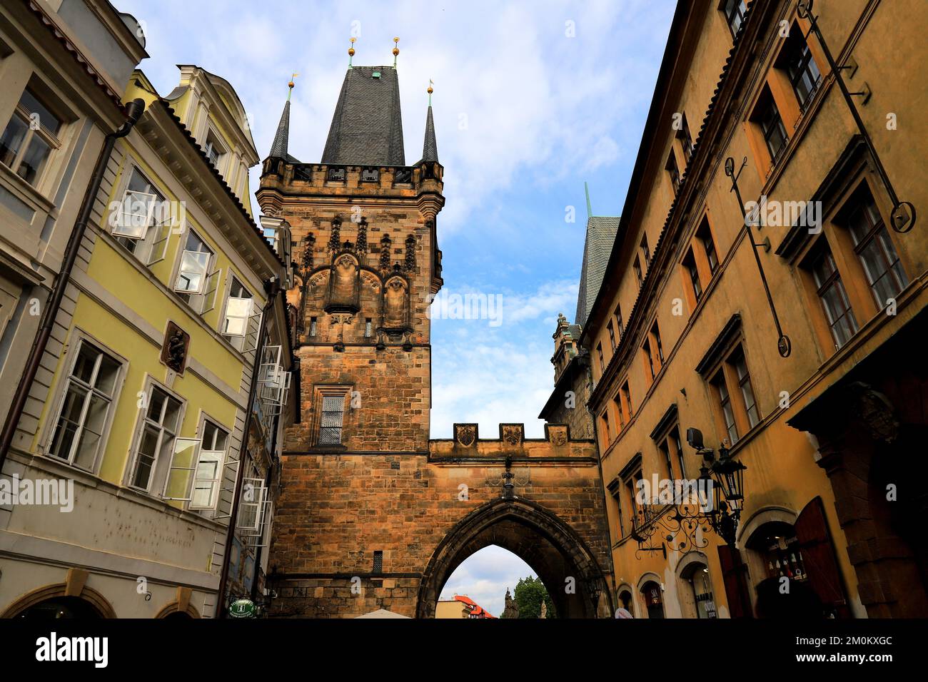 Gate to Charles Bridge located in Old Town in Prague. Strange medieval ...