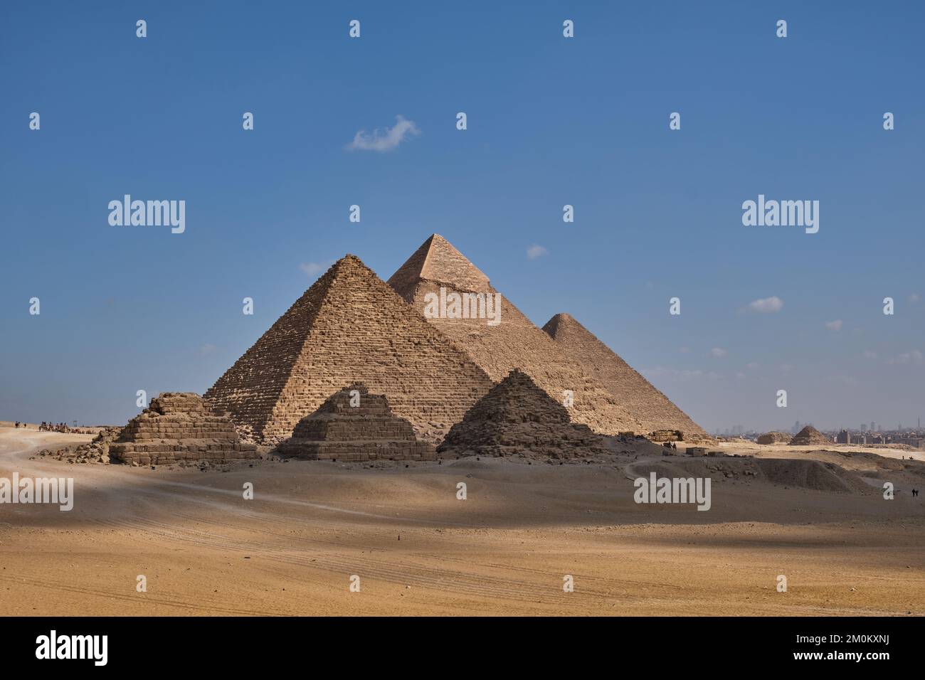 A scenic shot of the Giza pyramid complex against the blue sky in Egypt ...