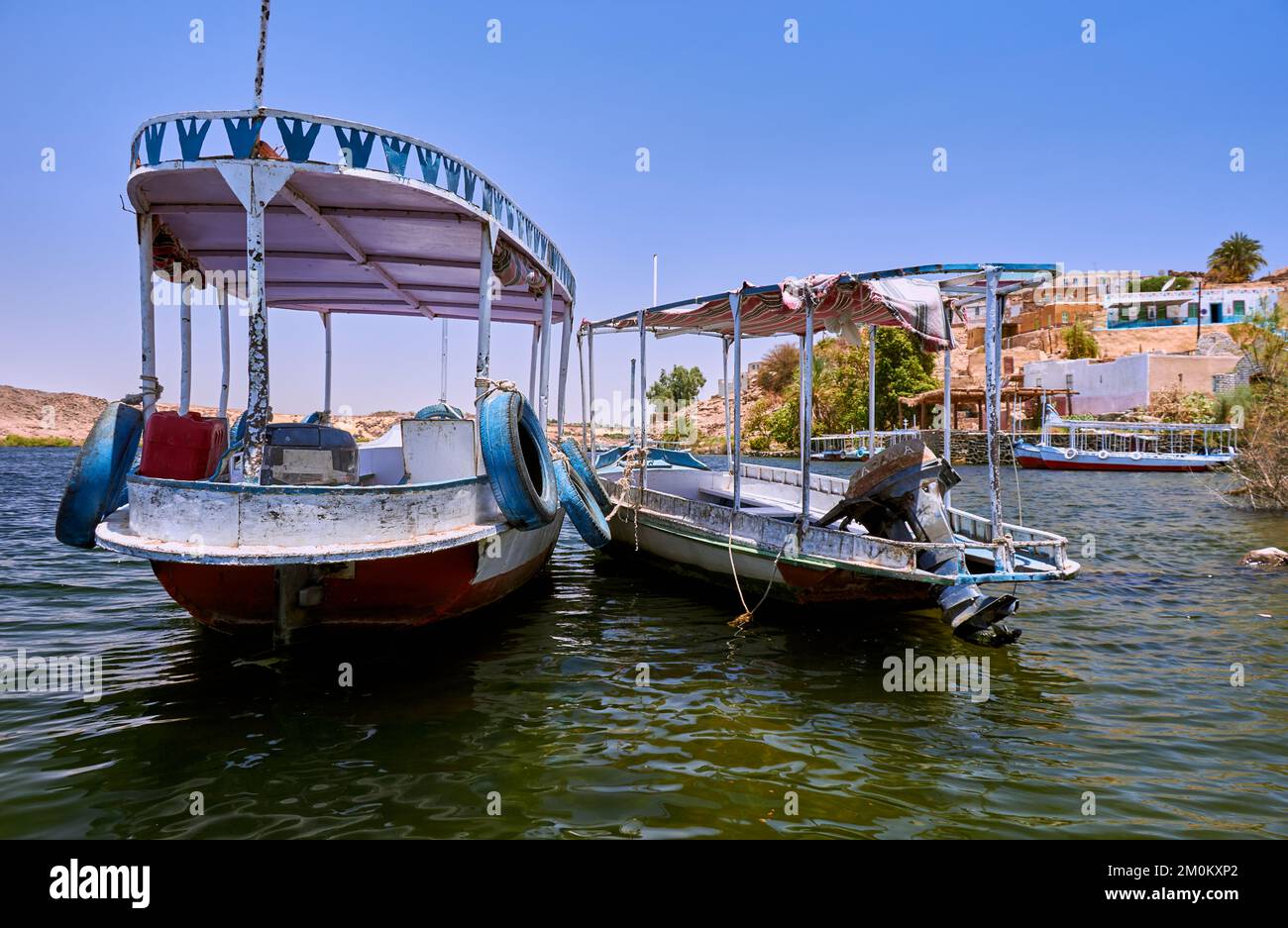 Two boats against the scenic cityscape on the seashore of Egypt Stock ...