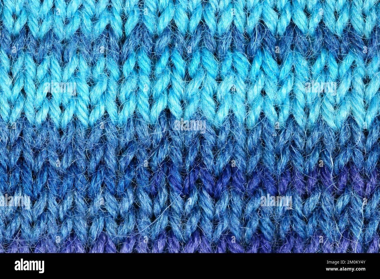 Knitted wool fabric material background Stock Photo - Alamy