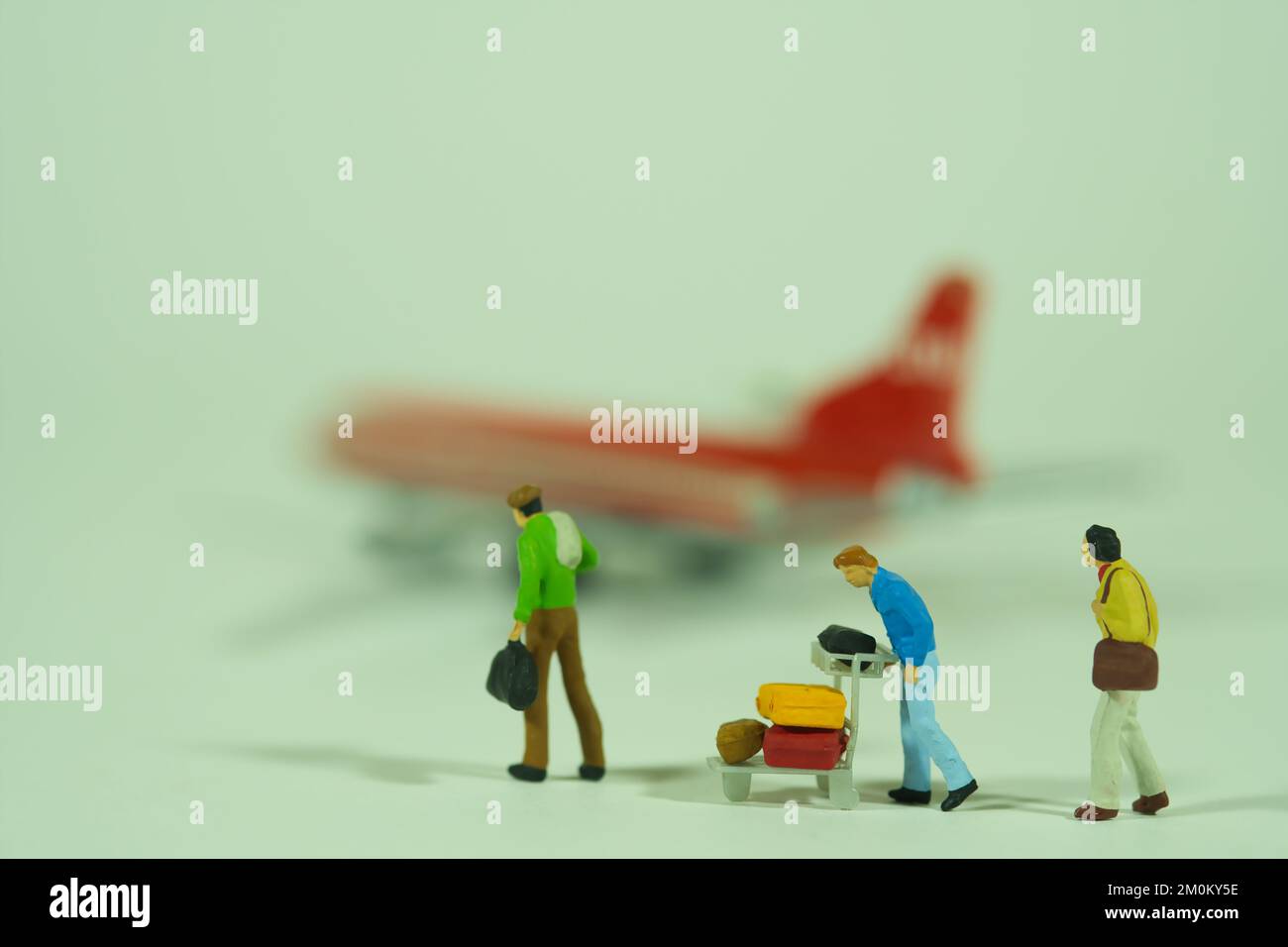 Traveling people with luggage in the airport, miniature figures scene ...
