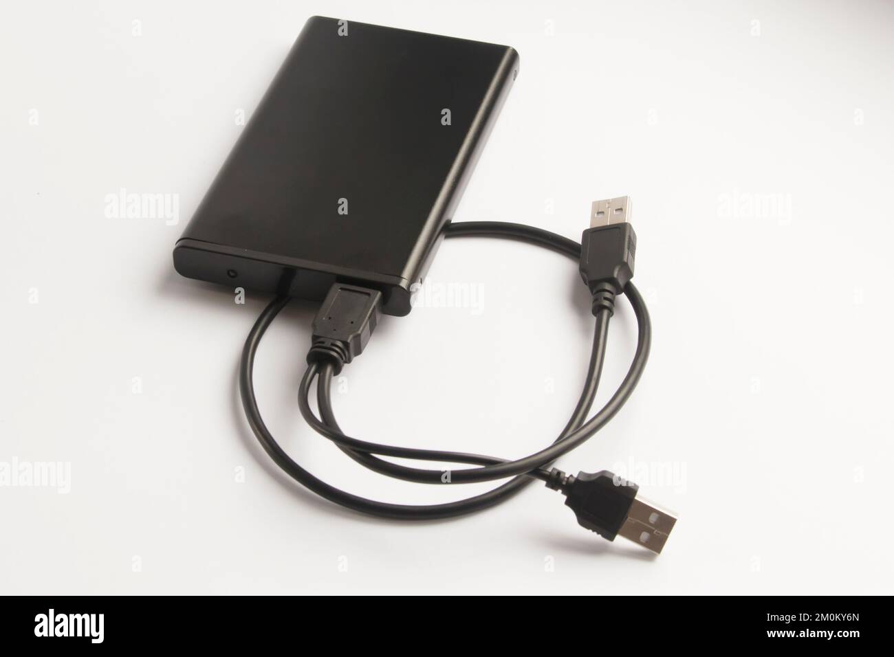 black portable USB disc drive in metal case with USB wire isolated on ...